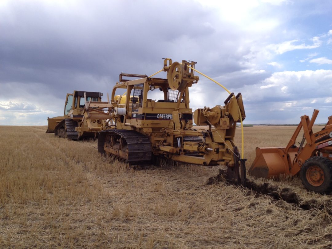 Plow and Tow Cat - Payot Trenching Ltd